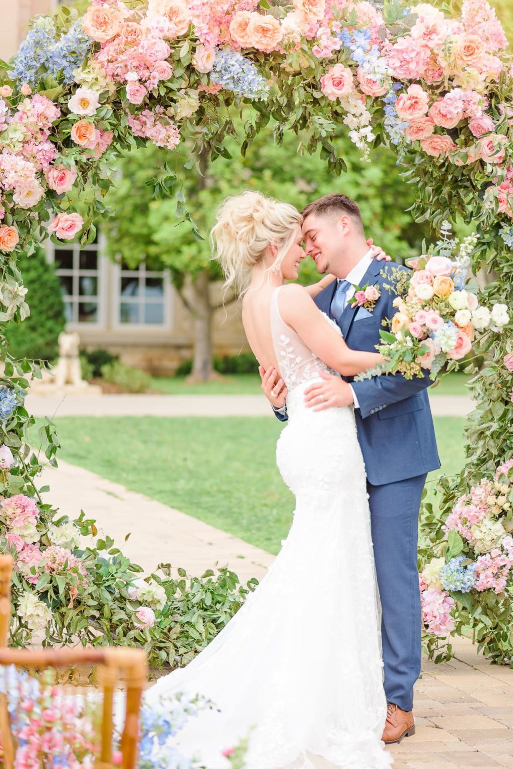 Backdrop with Flowers at this Wedding with Summer Colors